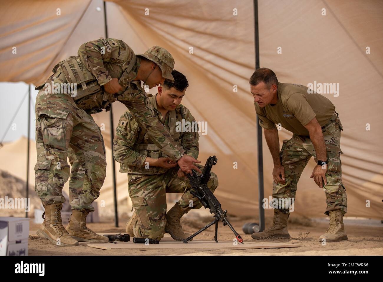 U.S. Army Spc. Samuel Vazquez, left, and Spc. Moises Valdez, center ...