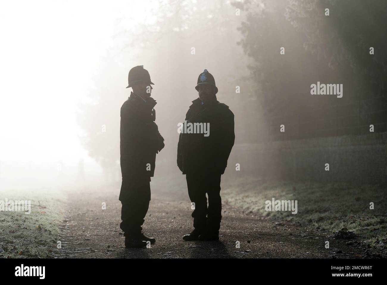 Police officers stand guard as King Charles III and the Queen Consort ...