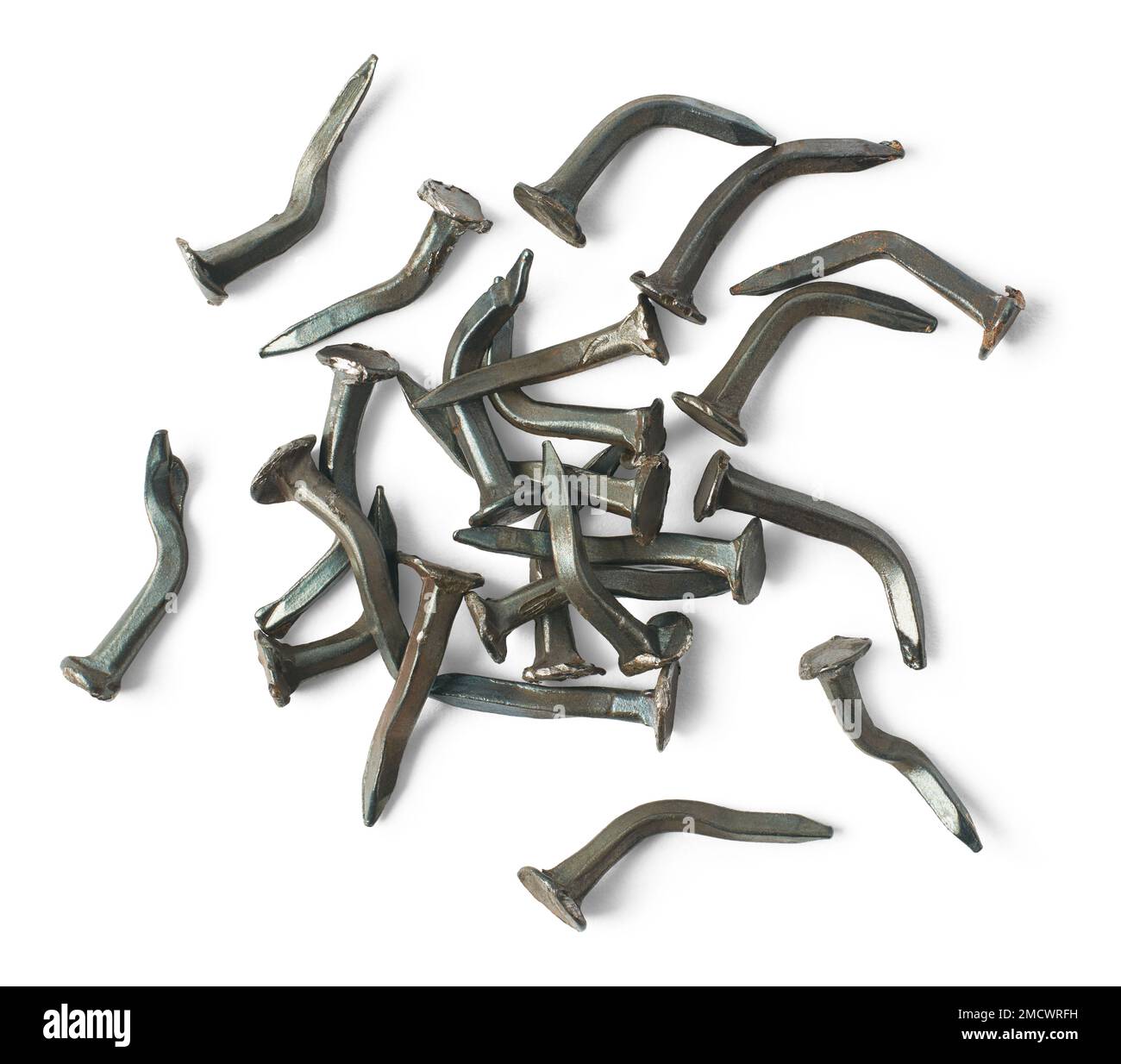 pile of unusable and warped nails isolated on white background, bent ...