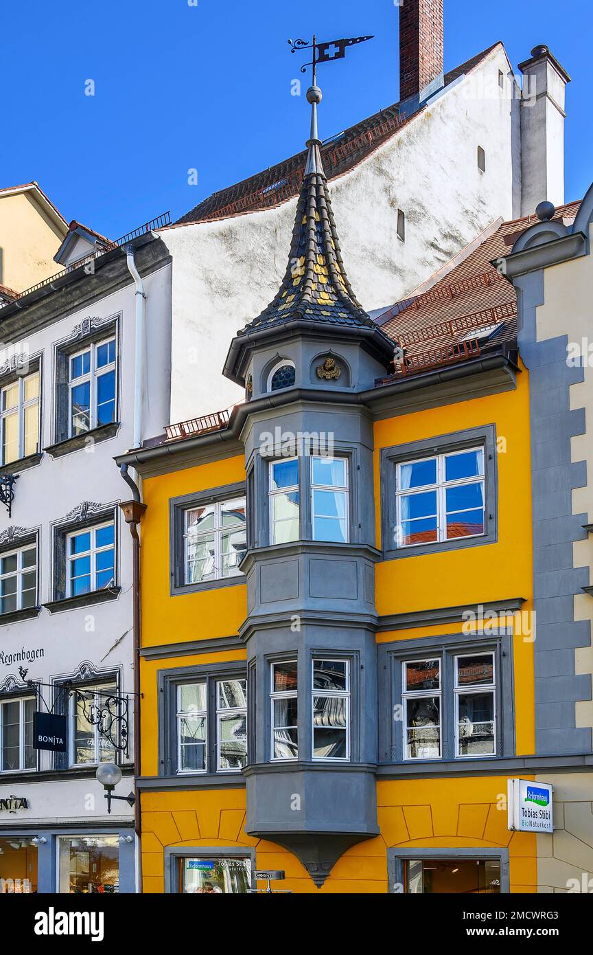Orange facade with bay window and turret with weather vane, Lindau ...