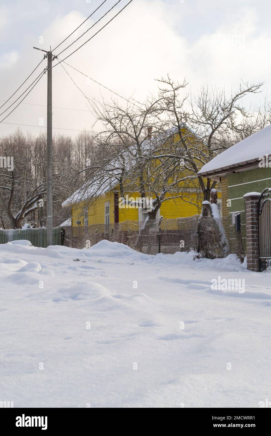 Snowy russian village, village with snowy road and houses Stock Photo ...