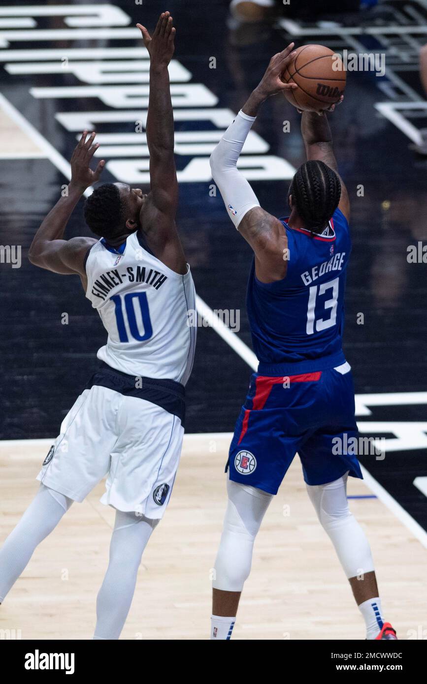 Los Angeles Clippers guard Paul George (13) makes a 3-point shot over ...