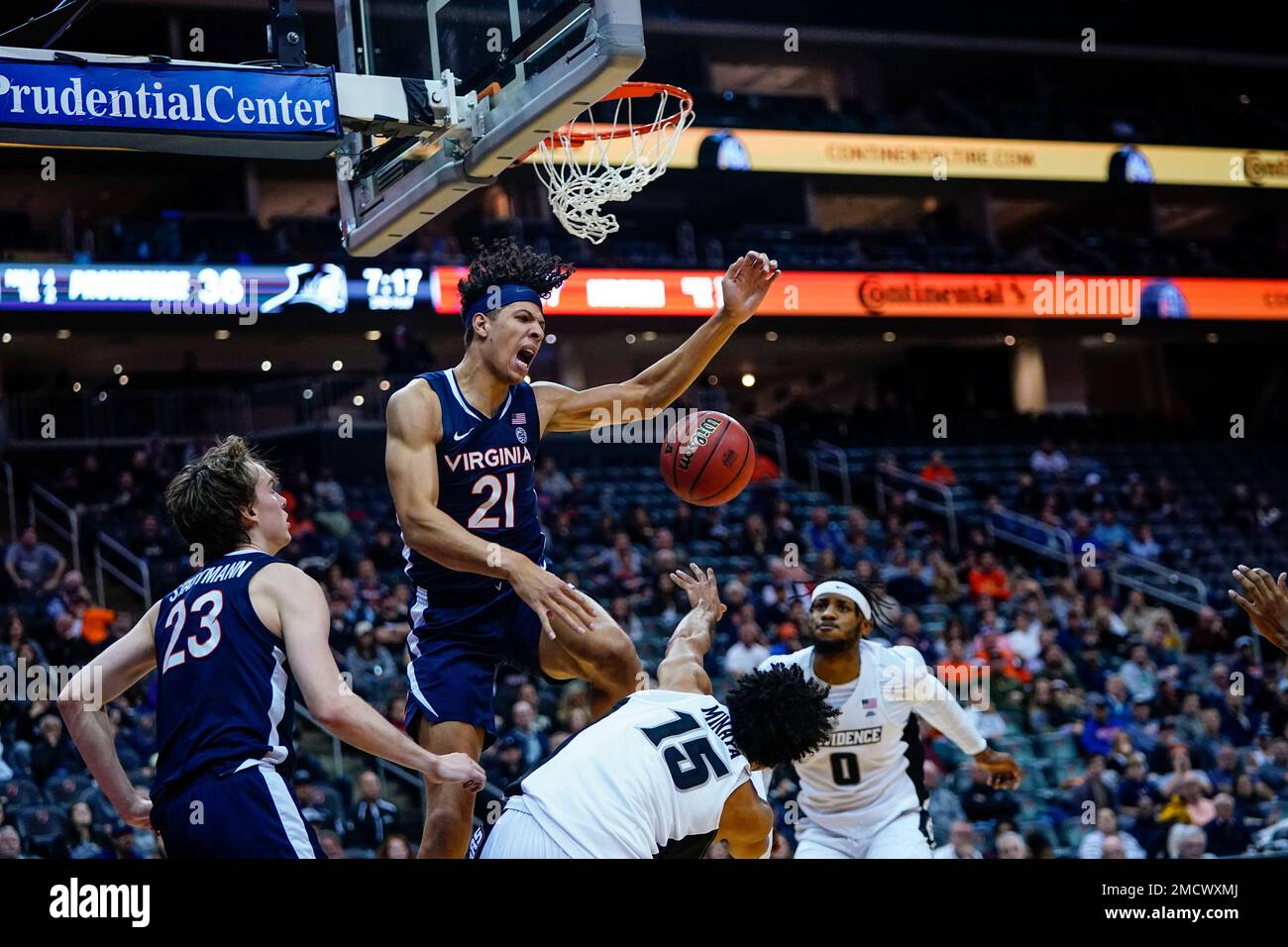 Virginia's Kadin Shedrick (21) blocks a shot by Providence's Justin ...