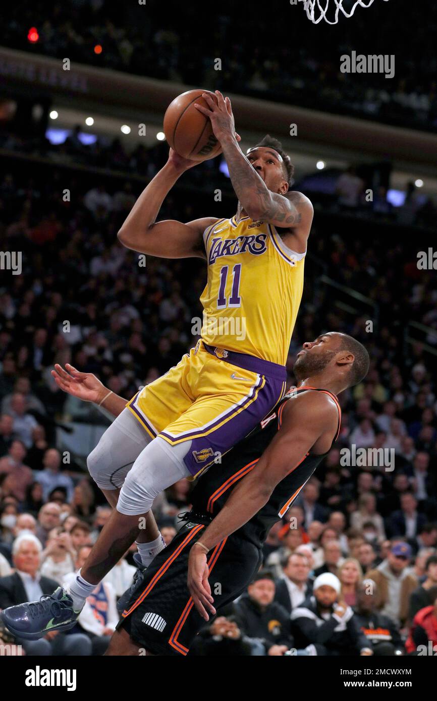 Los Angeles Lakers guard Malik Monk (11) attempts a shot against New ...