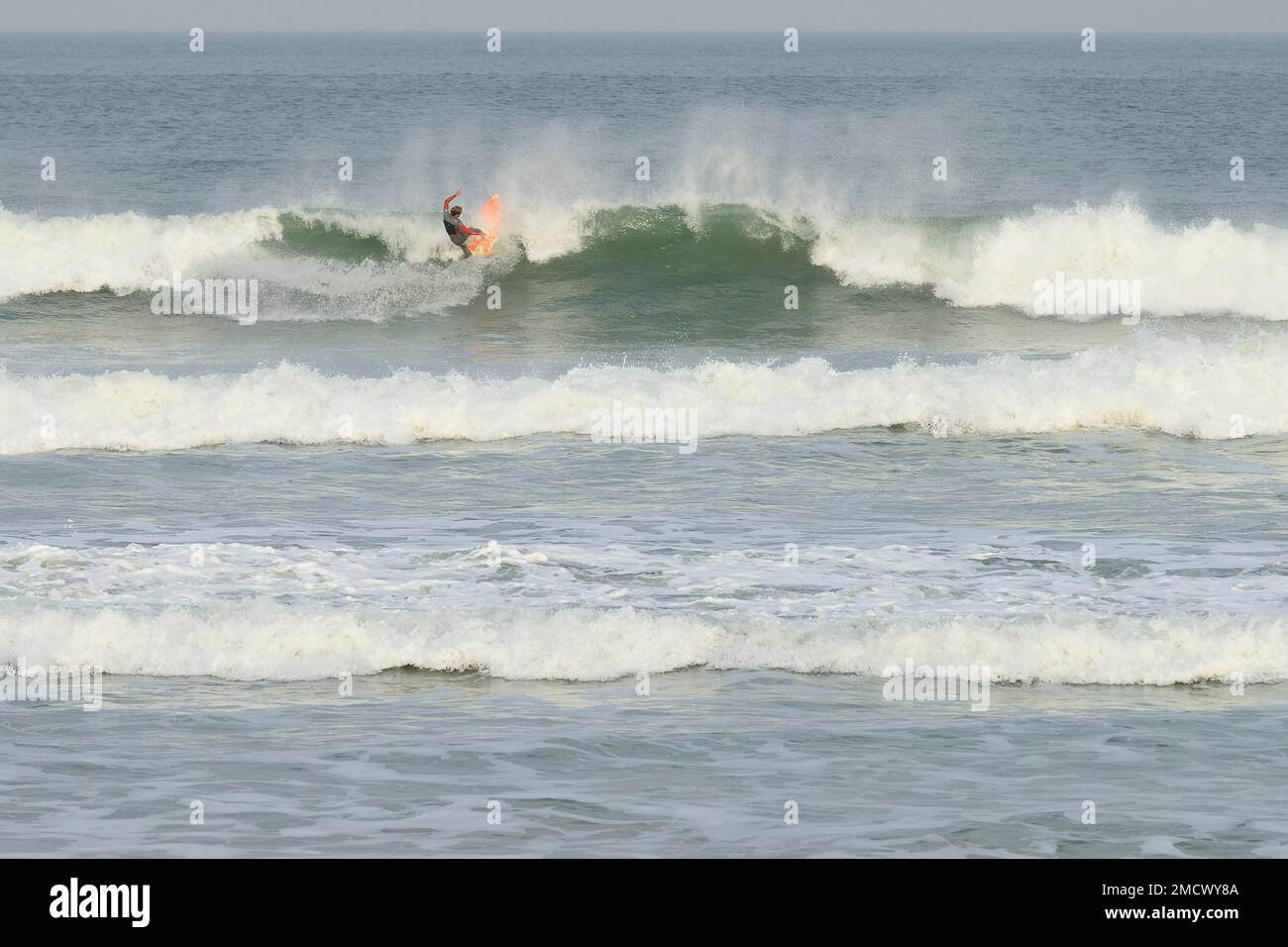 Surfer riding the wave at Praia de Mocambique, Ilha do Santa Catarina ...