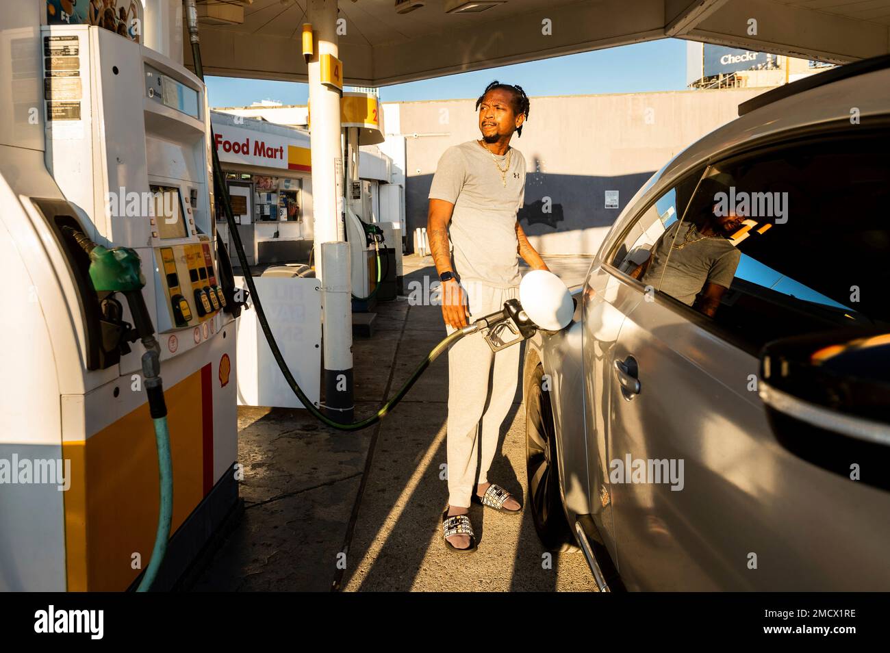 A motorist fills up at a Shell station on Monday, Nov. 22, 2021, in San ...