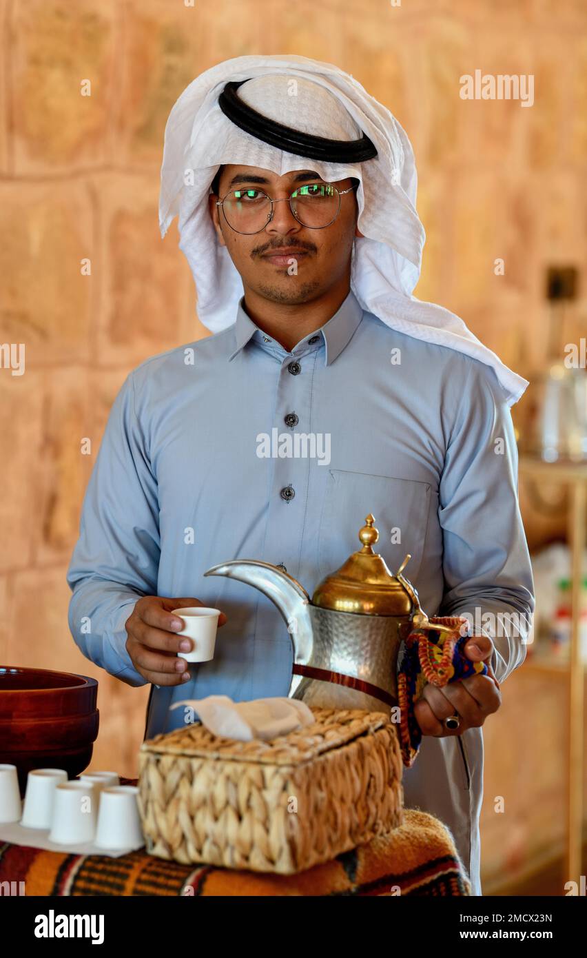 Young man serving Arabic coffee, AlUla, Medina Province, Saudi Arabia ...