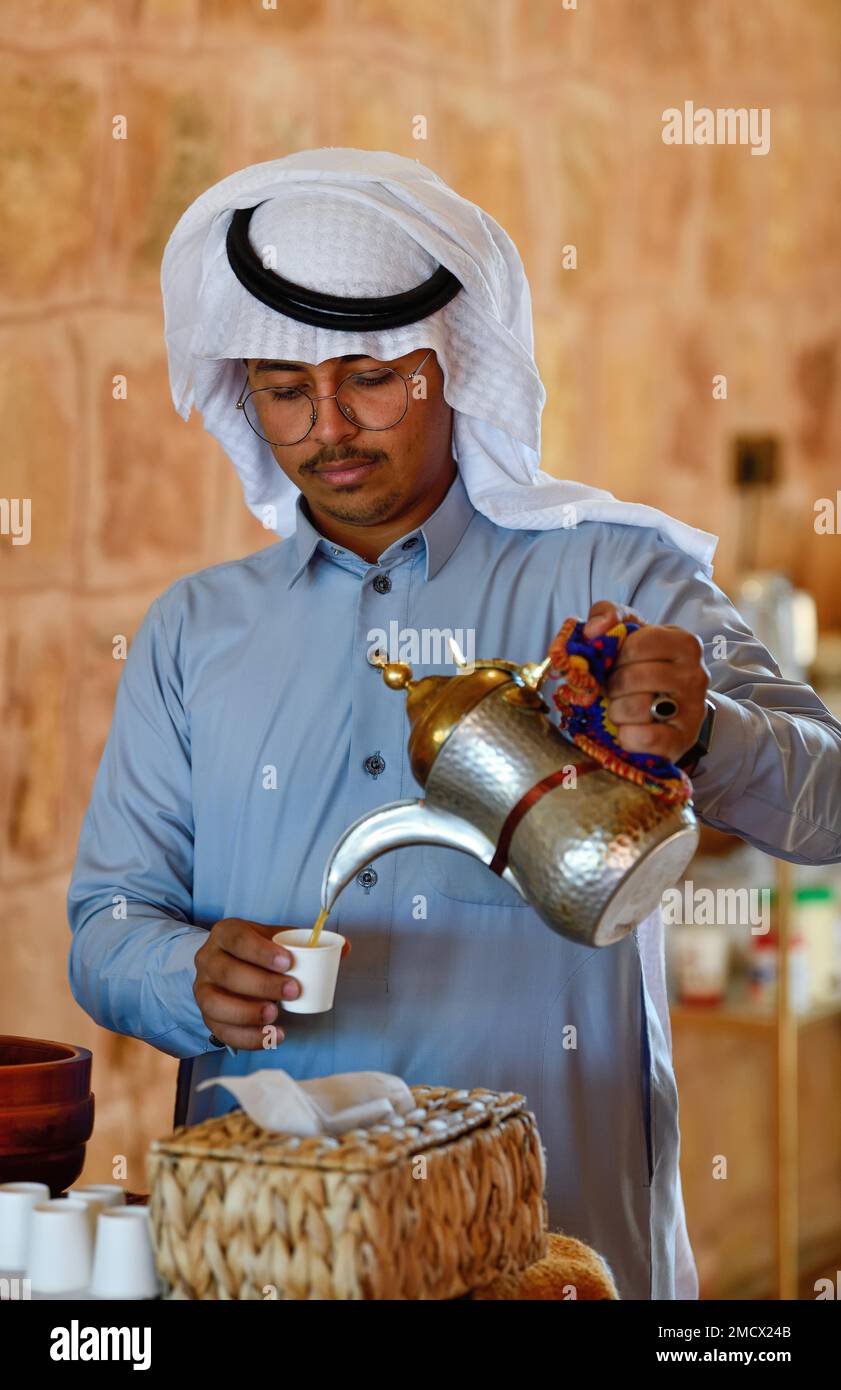 Young man serving Arabic coffee, AlUla, Medina Province, Saudi Arabia ...