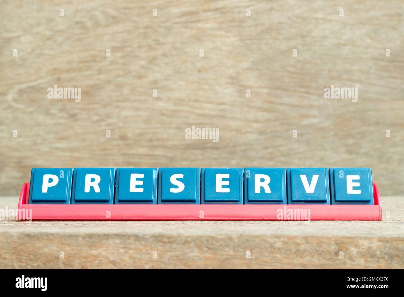 Tile alphabet letter with word preserve in red color rack on wood ...