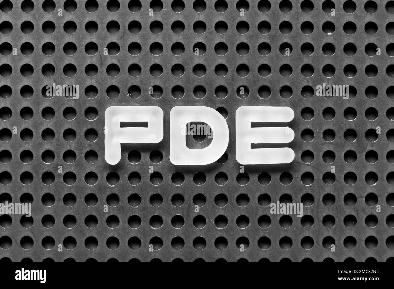 White alphabet letter in word PDE (abbreviation of permitted daily ...