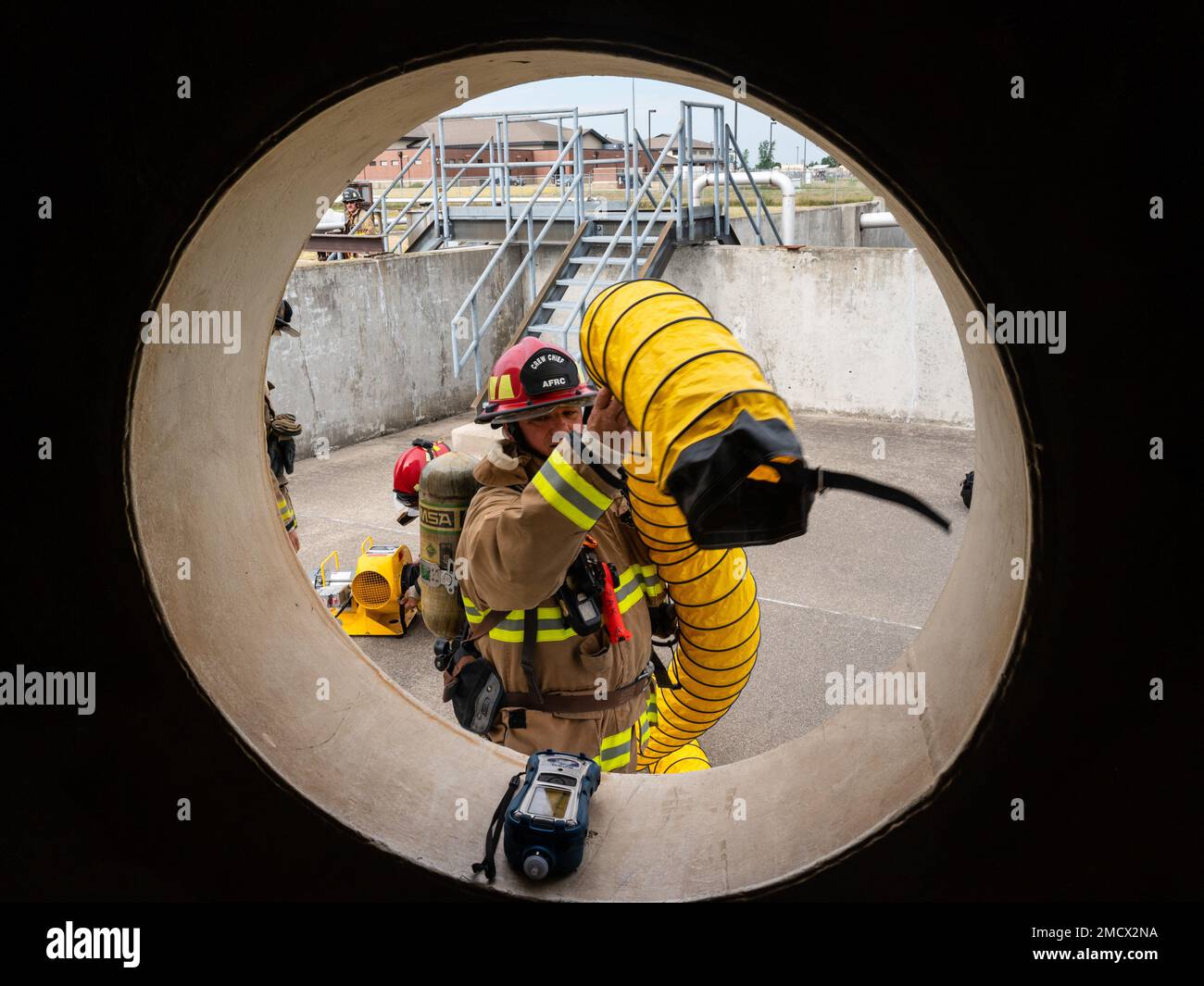 Tim Zack, with the 914th Fire Emergency Services, inserts a tunnel into ...
