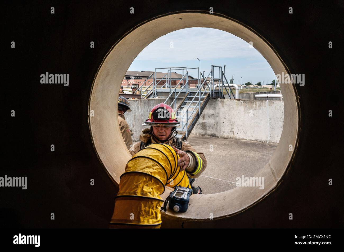 Tim Zack, with the 914th Fire Emergency Services, inserts a tunnel into ...