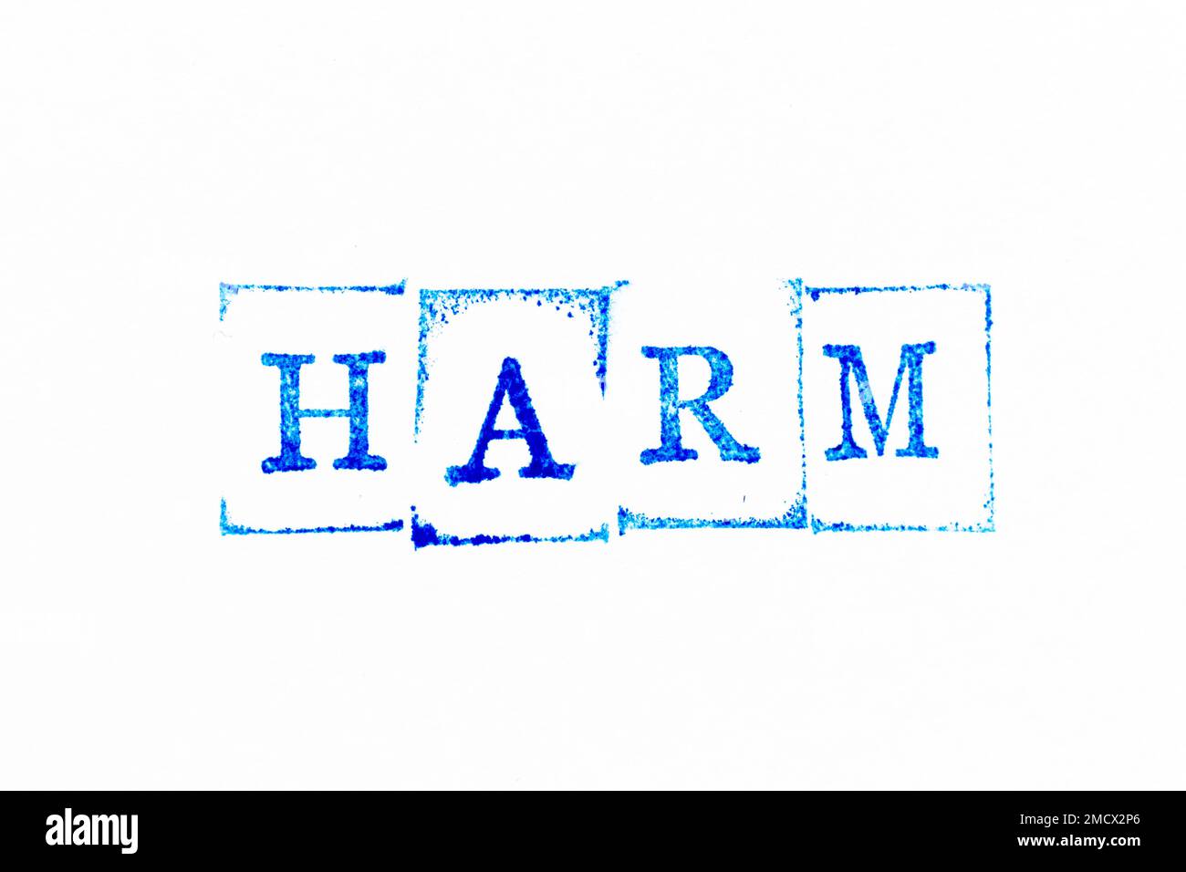 Blue color ink rubber stamp in word harm on white paper background ...