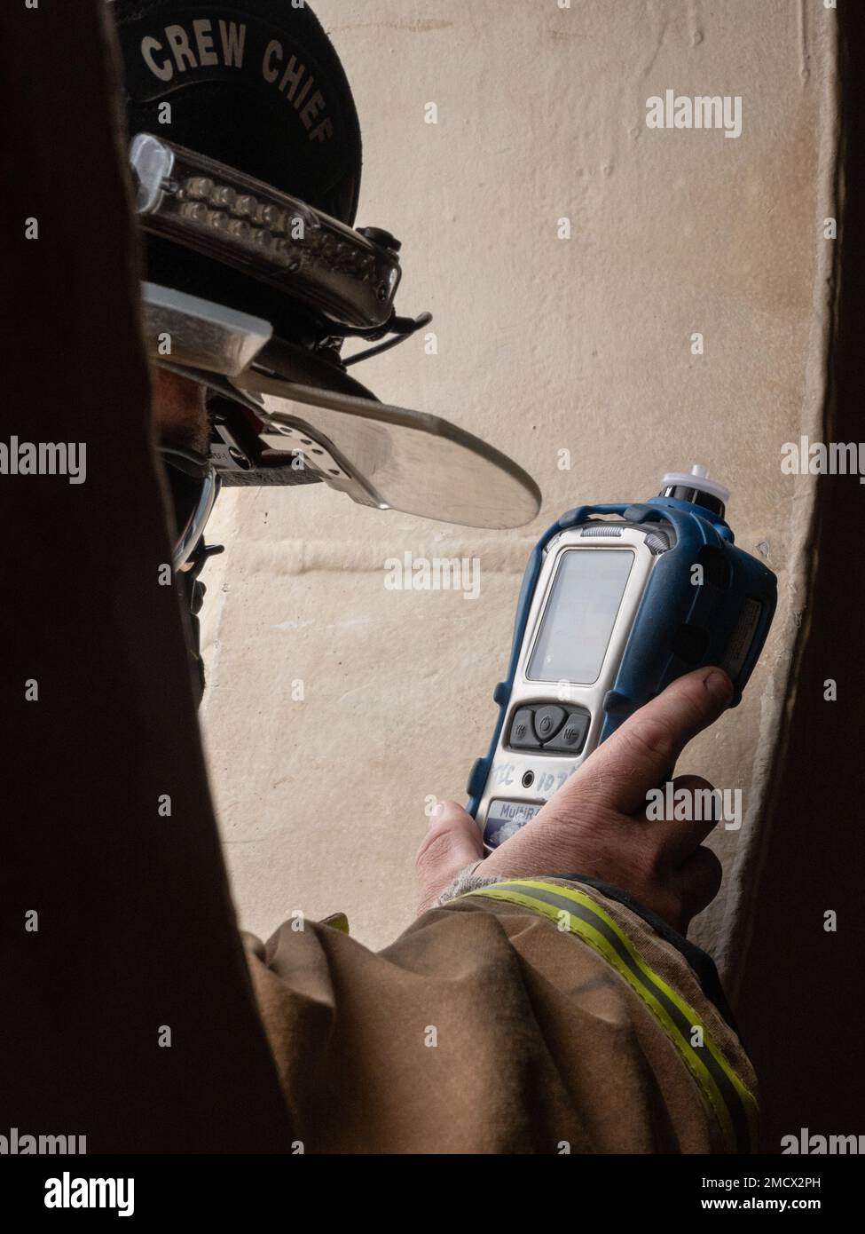 A firefighter with the 914th Fire Emergency Services holds a multi gas ...