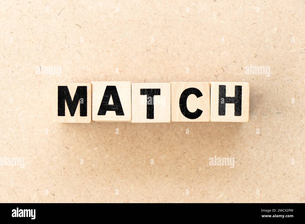 Alphabet letter block in word match on wood background Stock Photo - Alamy