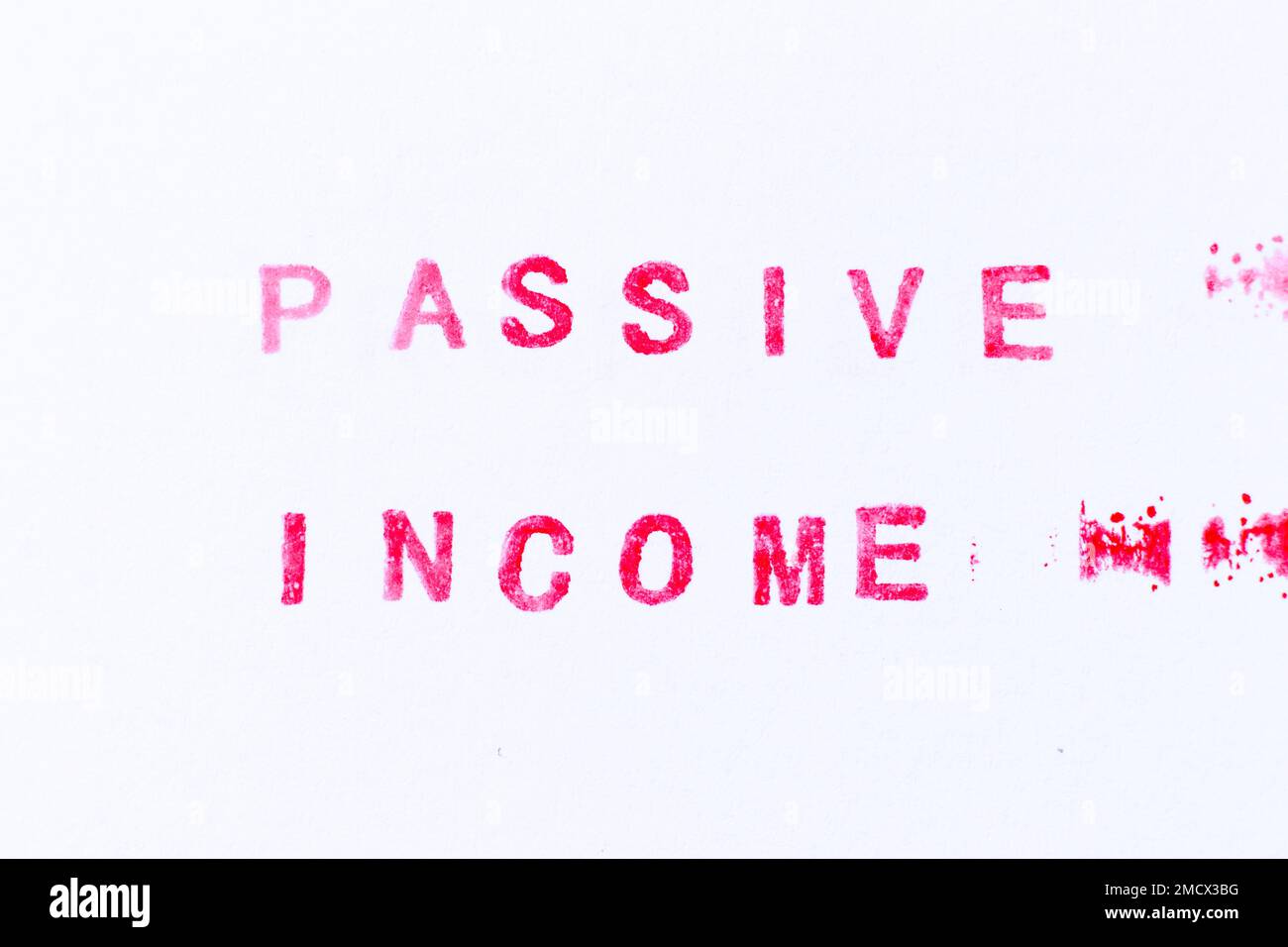 Red color ink rubber stamp in word passive income on white paper ...