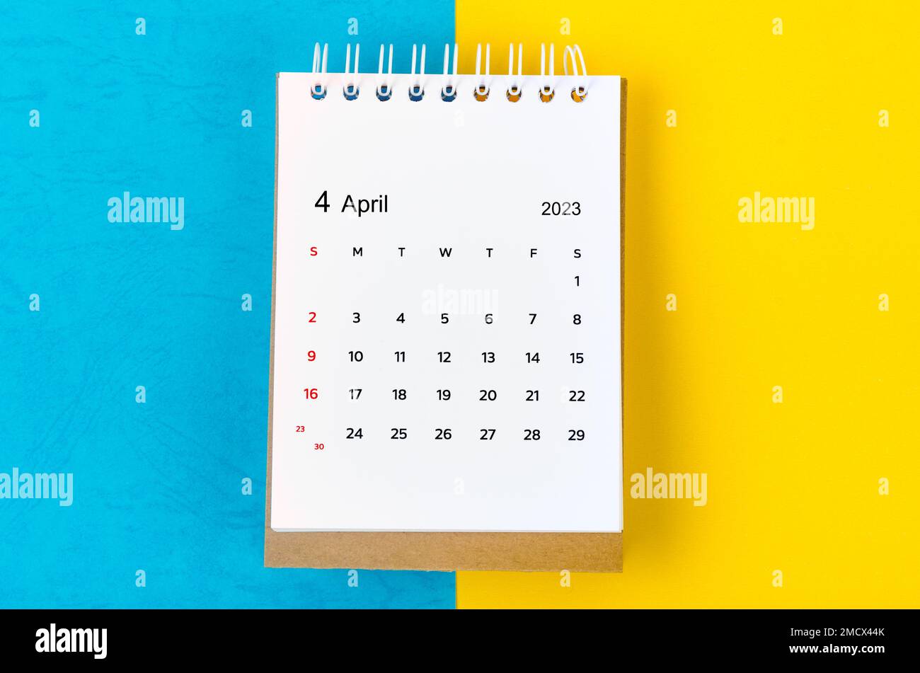April 2023 Monthly desk calendar for 2023 year on blue and yellow ...