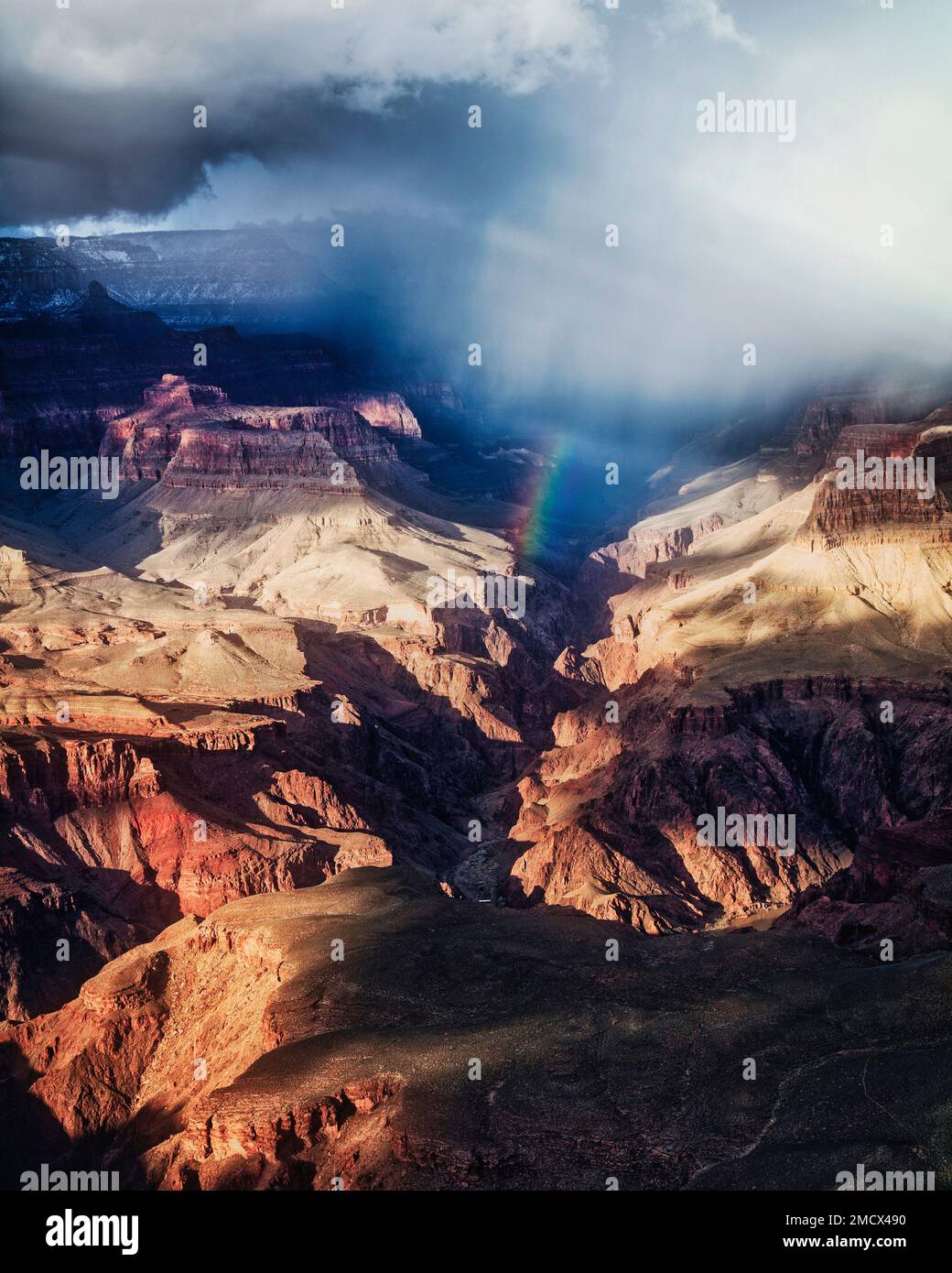 A storm passes over Bright Angel Canyon producing a temporary rainbow ...