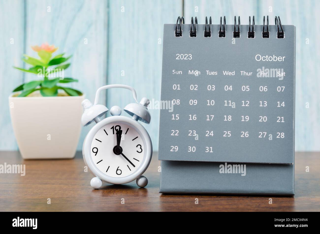 October 2023 Monthly desk calendar for 2023 year with alarm clock on ...