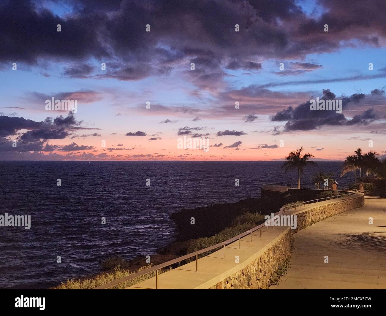 A beautiful rosy sunset with a gloomy cloudy sky on the horizon Stock ...