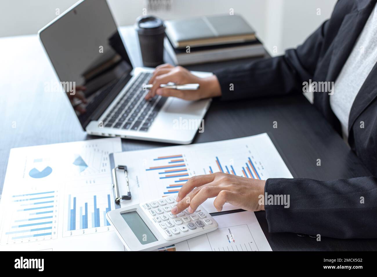 Accounting businessmen are calculating income-expenditure and analyzing ...