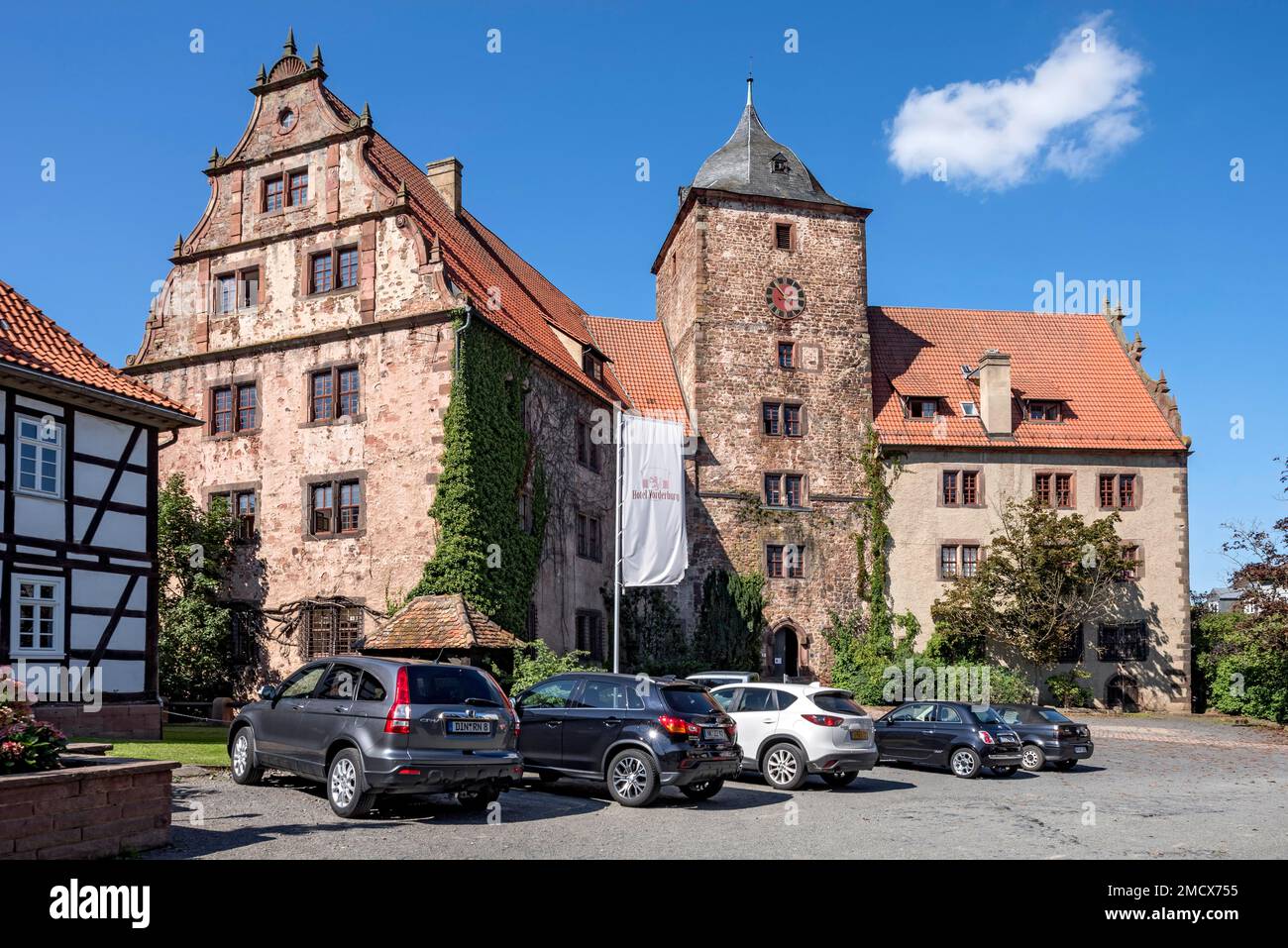 Medieval front castle with residential tower and Renaissance gables ...