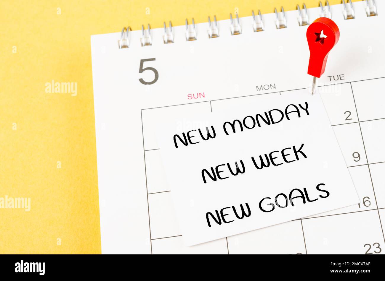 Inspirational and Motivational Concept - New monday new week new goals text on desk calendar ...