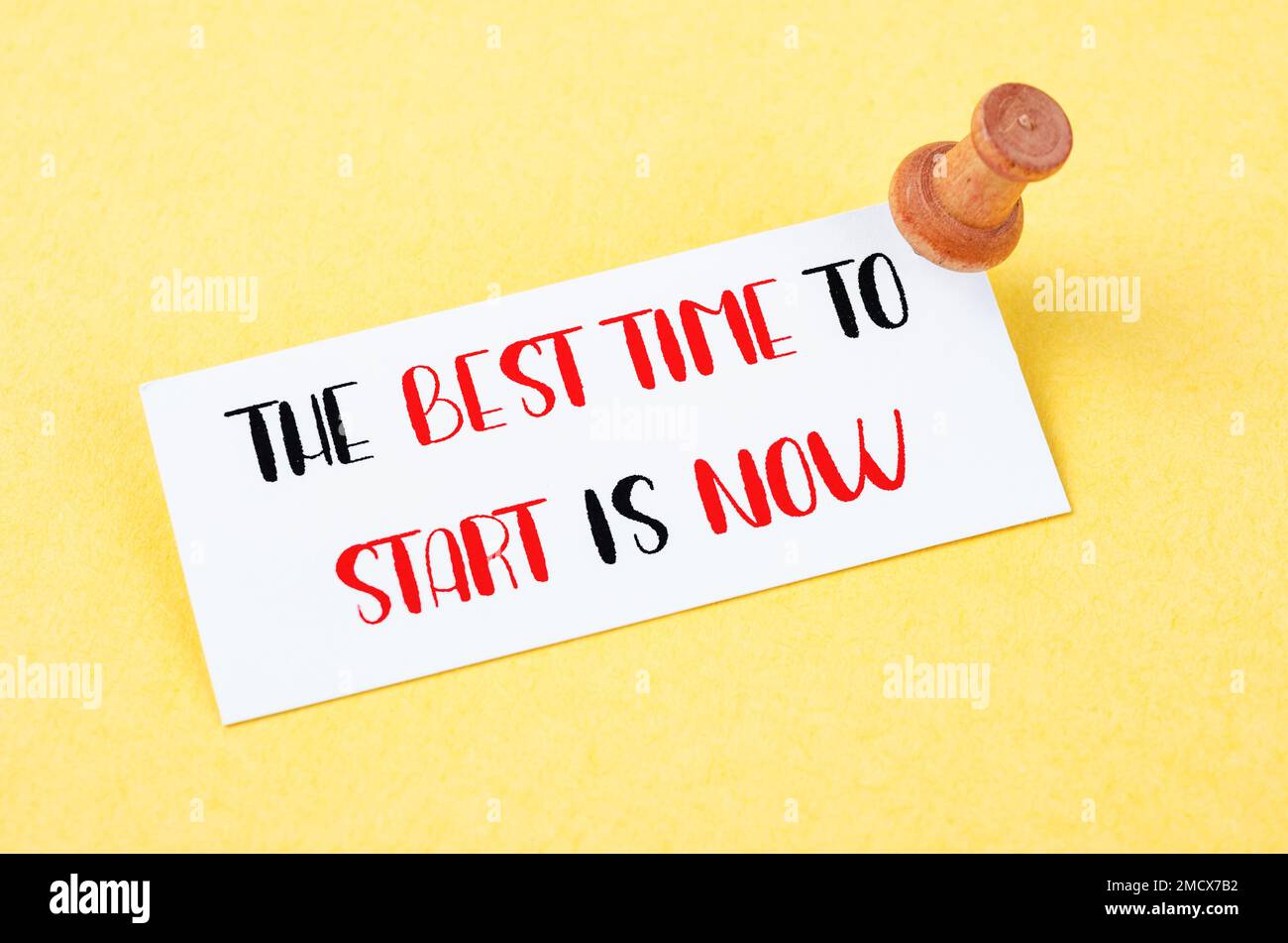 Best time to start is now with wooden push pin on yellow background ...