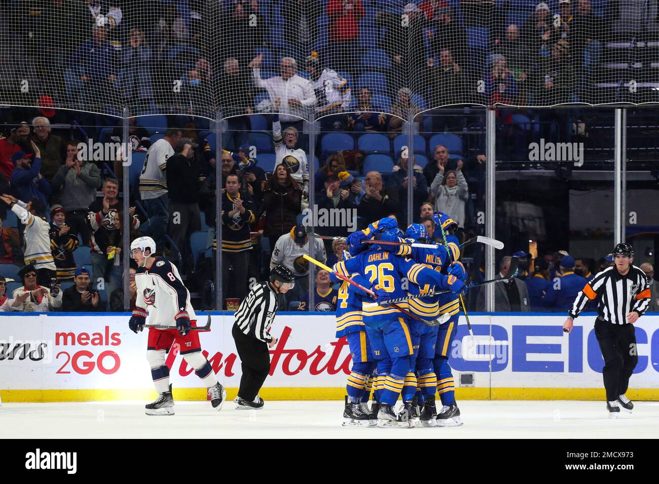 Buffalo Sabres players celebrate after a goal by center Zemgus ...