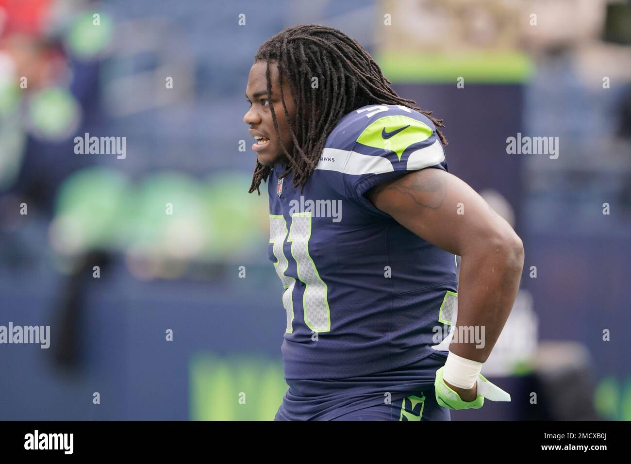 Seattle Seahawks ' DeeJay Dallas walks on the field before an NFL ...