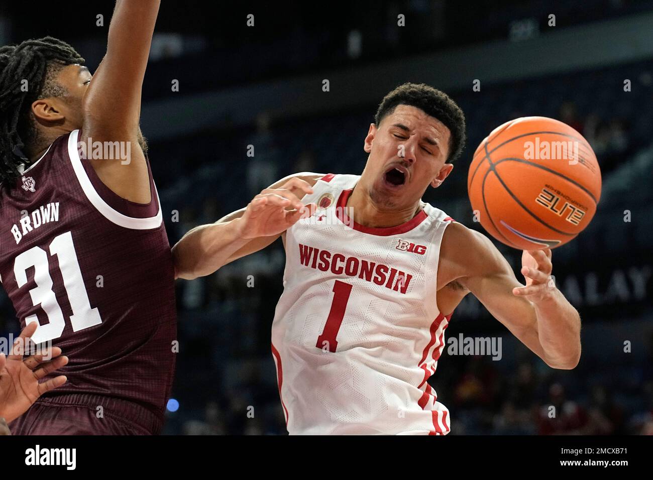 Wisconsin guard Johnny Davis (1) is fouled by Texas A&M forward Javonte ...