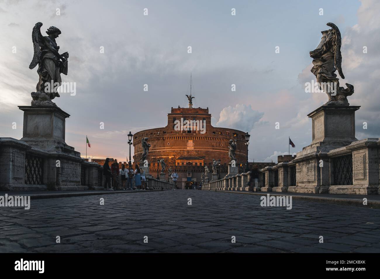 The St. Angelo Bridge under blue cloudy sky in Rome, Italy Stock Photo ...