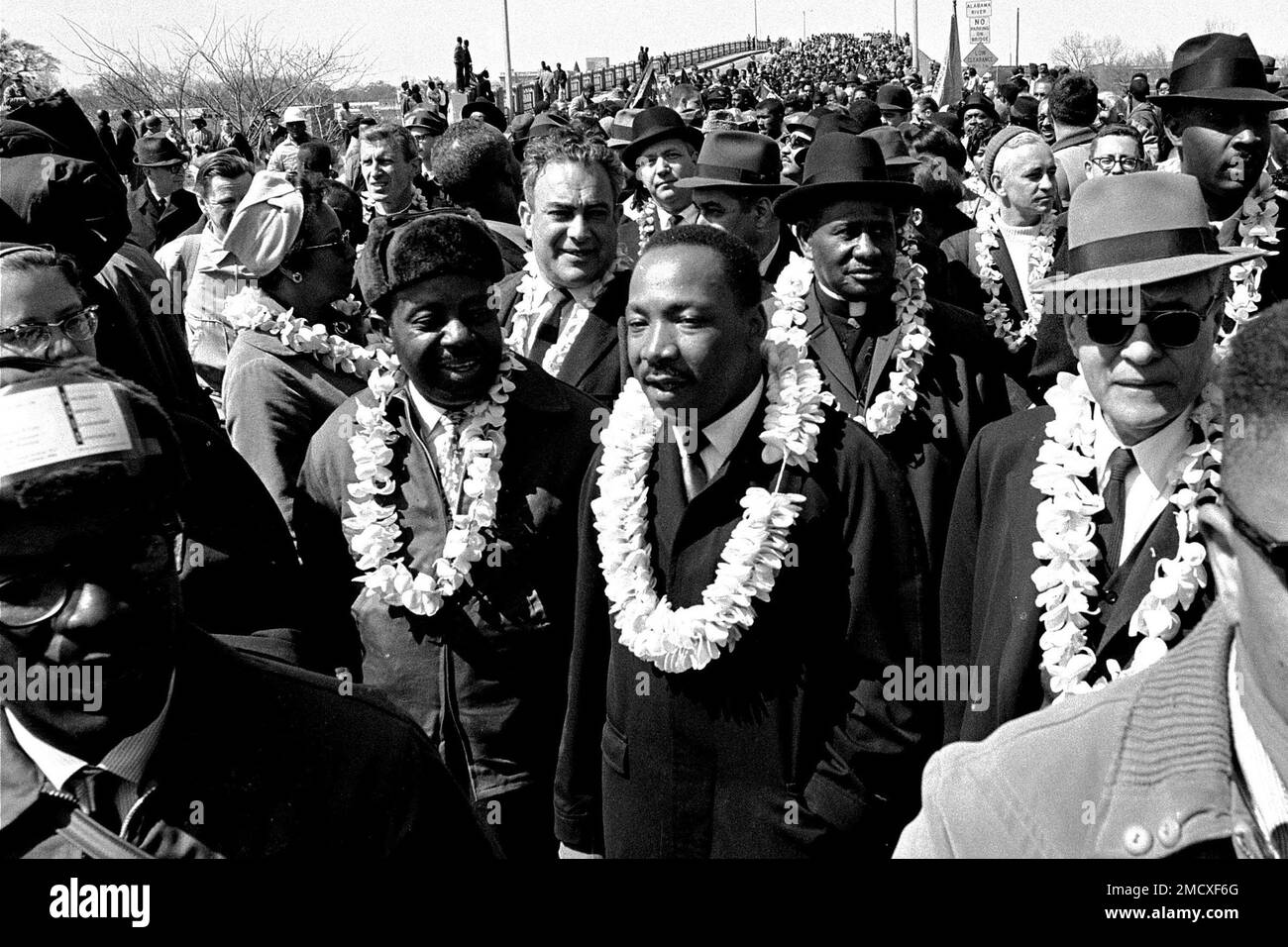 FILE - Martin Luther King, Jr. crosses the Edmund Pettus Bridge in ...