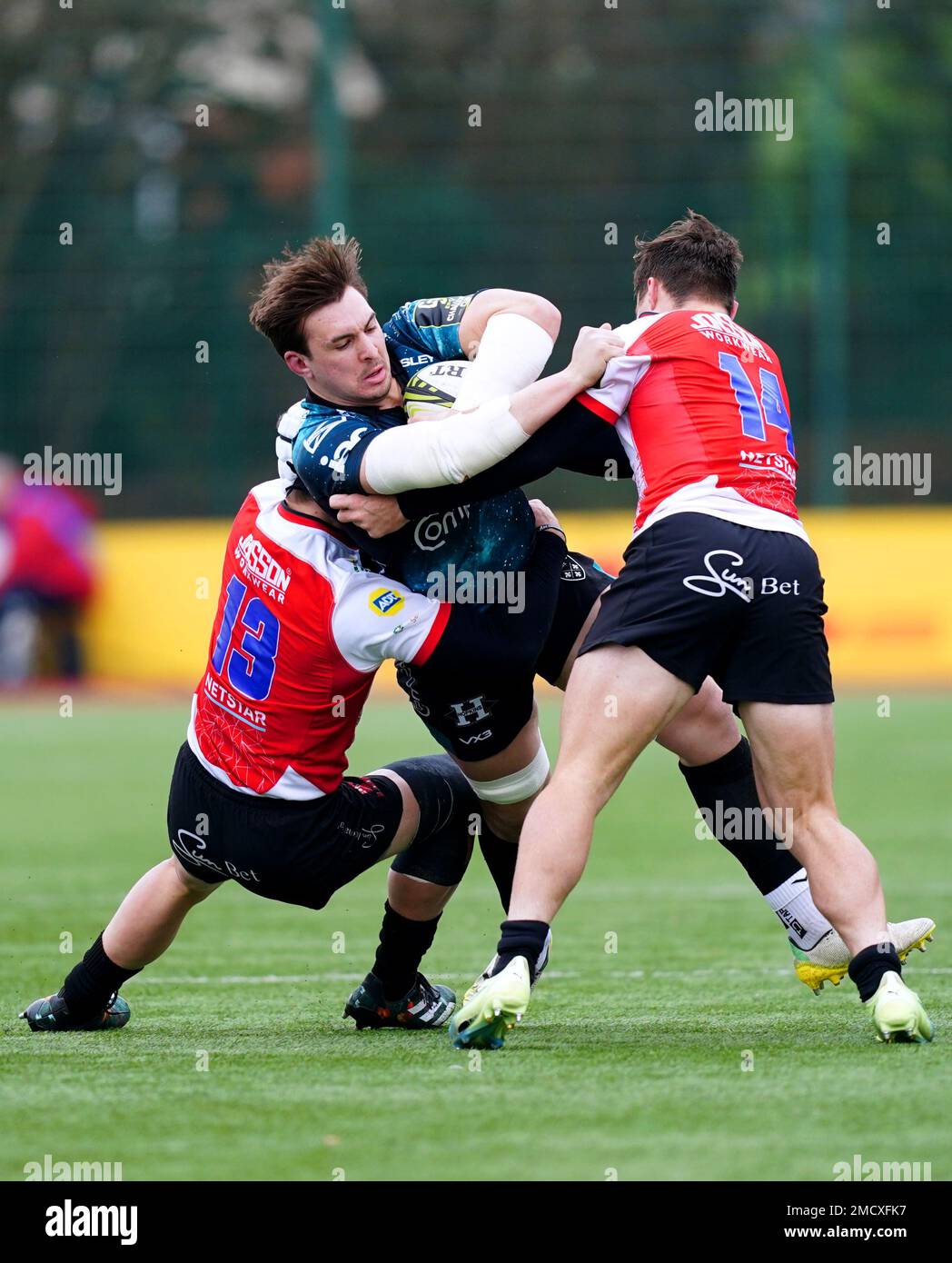Dragons' Taine Basham is tackled by Emirates Lions' Henco van Wyk (left ...