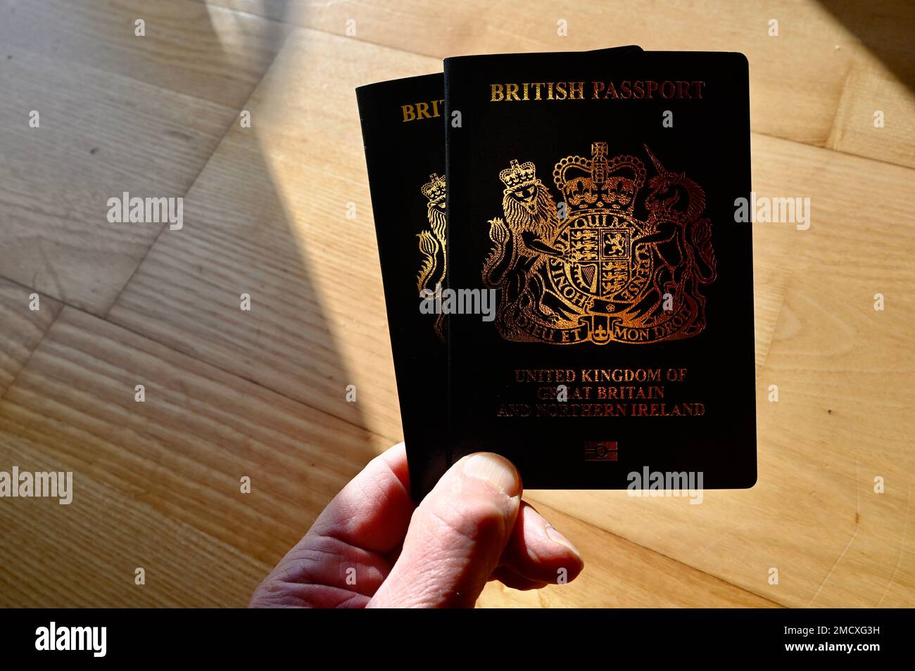 Navy blue passports hi-res stock photography and images - Alamy