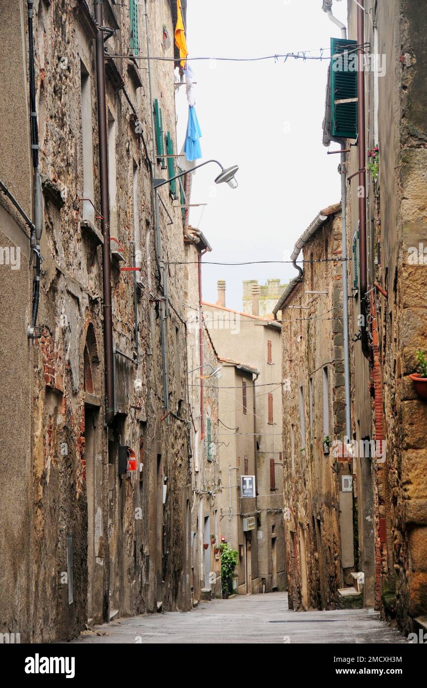 Medieval Street Scene with blue white and yellow washing hanging high ...