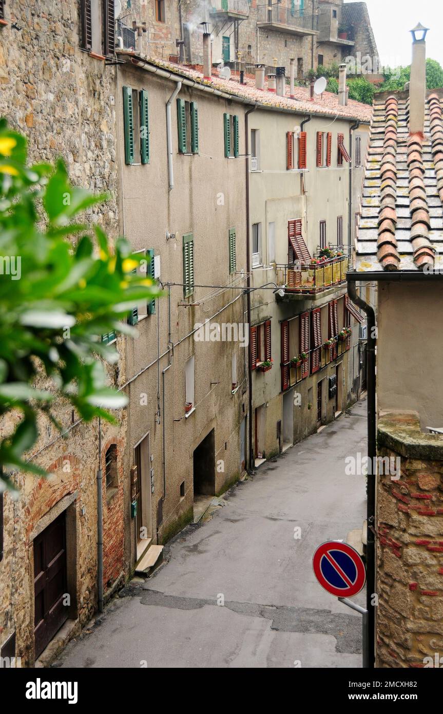 Very old rendered houses on a narrow hilly street hi-res stock ...