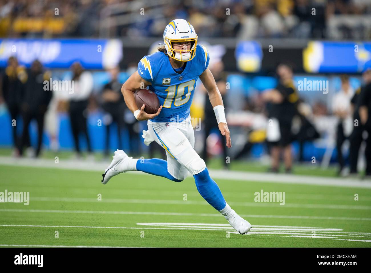 Los Angeles Chargers quarterback Justin Herbert (10) runs with the ball ...