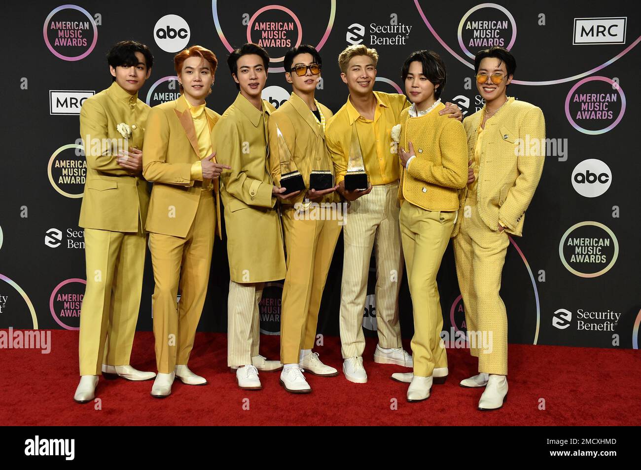 BTS poses in the press room with the awards for favorite pop duo or ...