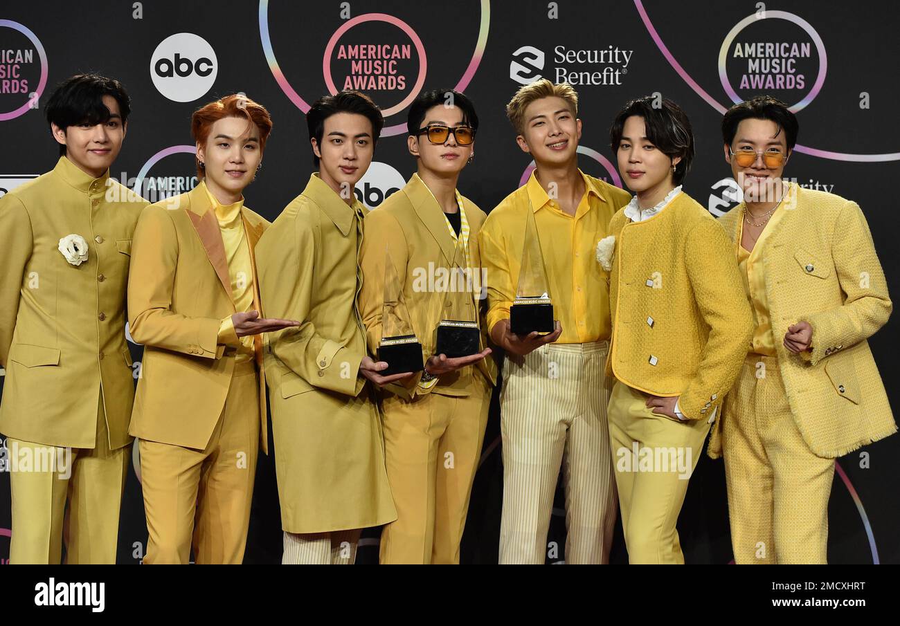 BTS poses in the press room with the awards for favorite pop duo or ...