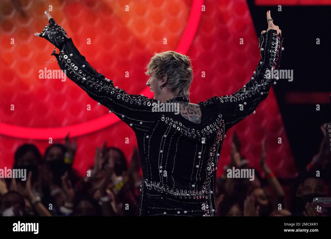 Machine Gun Kelly accepts the award for favorite rock artist at the ...
