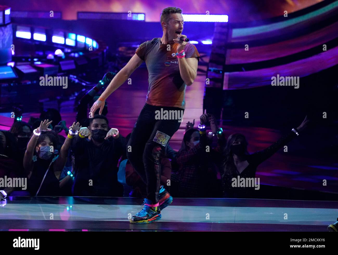 Chris Martin of Coldplay performs "My Universe" at the American Music ...