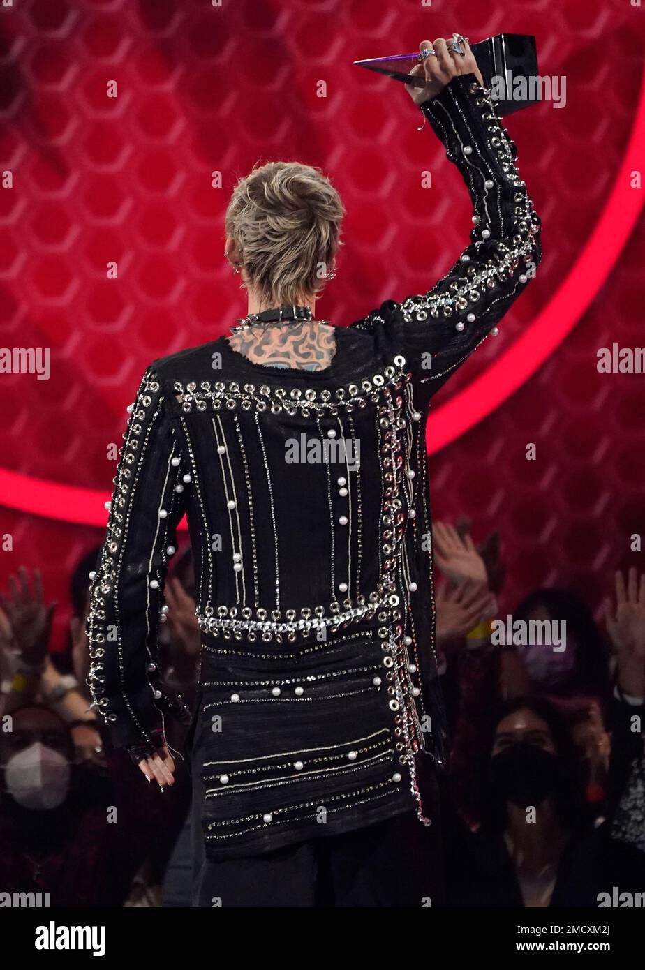 Machine Gun Kelly accepts the award for favorite rock artist at the ...