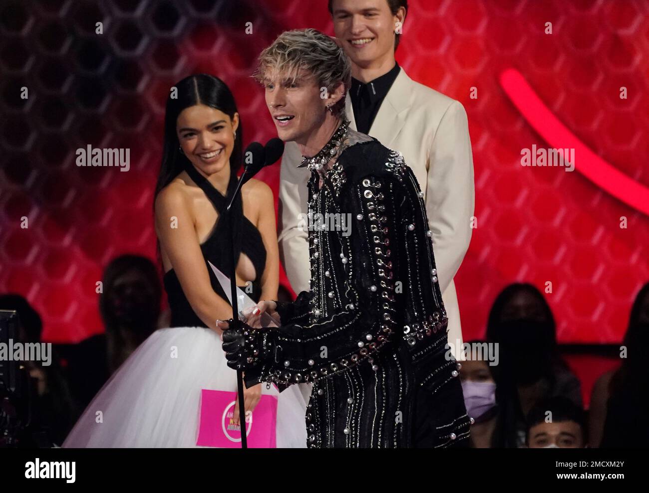 Machine Gun Kelly accepts the award for favorite rock artist at the ...