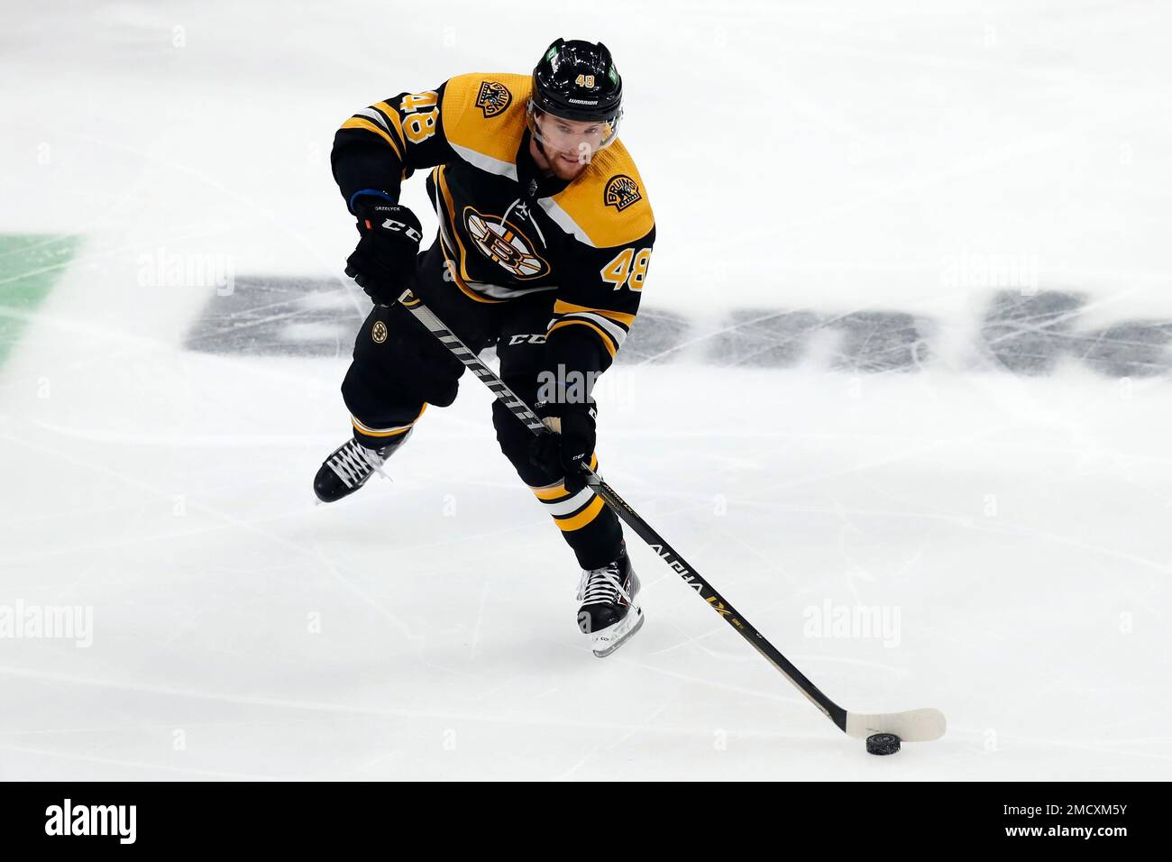 Boston Bruins' Matt Grzelcyk plays against the Calgary Flames during the first period of an NHL ...