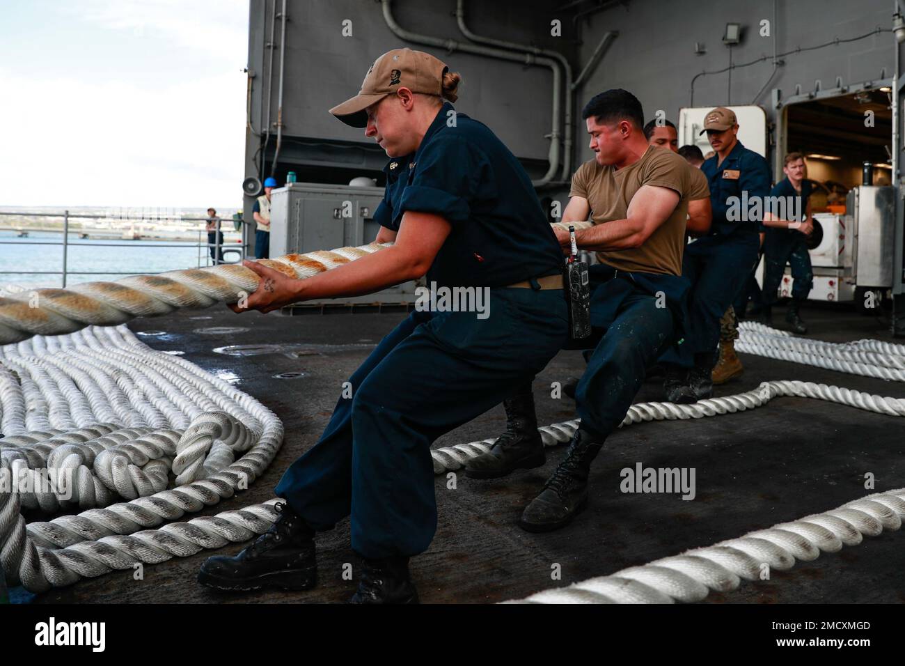 220711-N-CH260-1177 PEARL HARBOR (July 11, 2022) Sailors handle line on ...