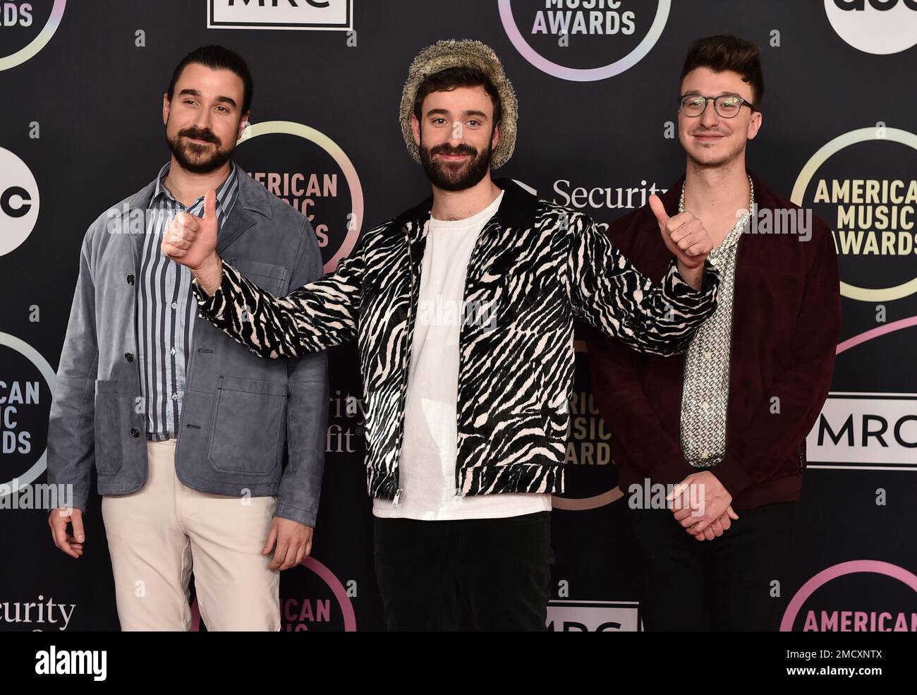 Adam Brett Met, from left, Jack Met and Ryan Met of AJR arrive at the ...