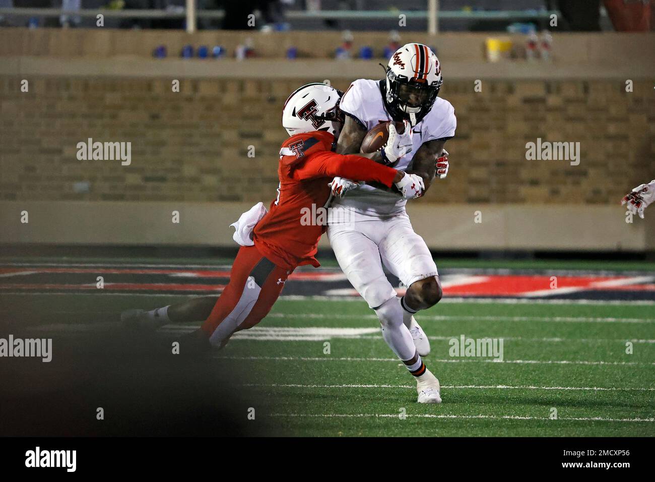 Texas Tech's Dadrion Taylor-Demerson (25) tackles Oklahoma State's Tay ...
