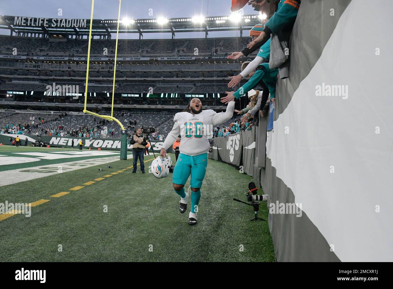 Miami Dolphins' Robert Hunt leaves the field after an NFL football game ...