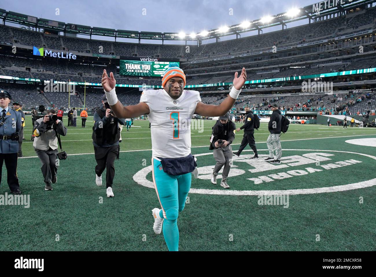Miami Dolphins quarterback Tua Tagovailoa celebrates as he leaves the ...
